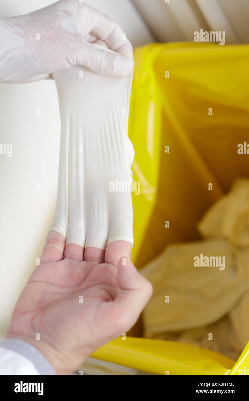 Health care professional taking off hi-res stock photography and images ...