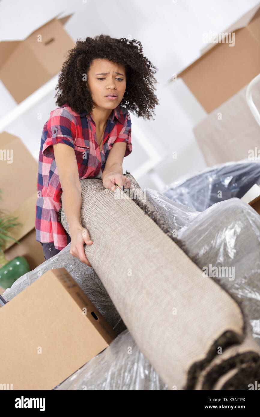 Carrying a roll of carpet hi-res stock photography and images - Alamy