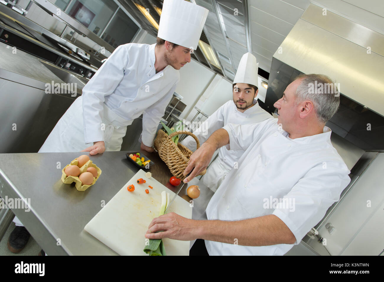 chef preparing food in the kitchen at the restaurant Stock Photo - Alamy