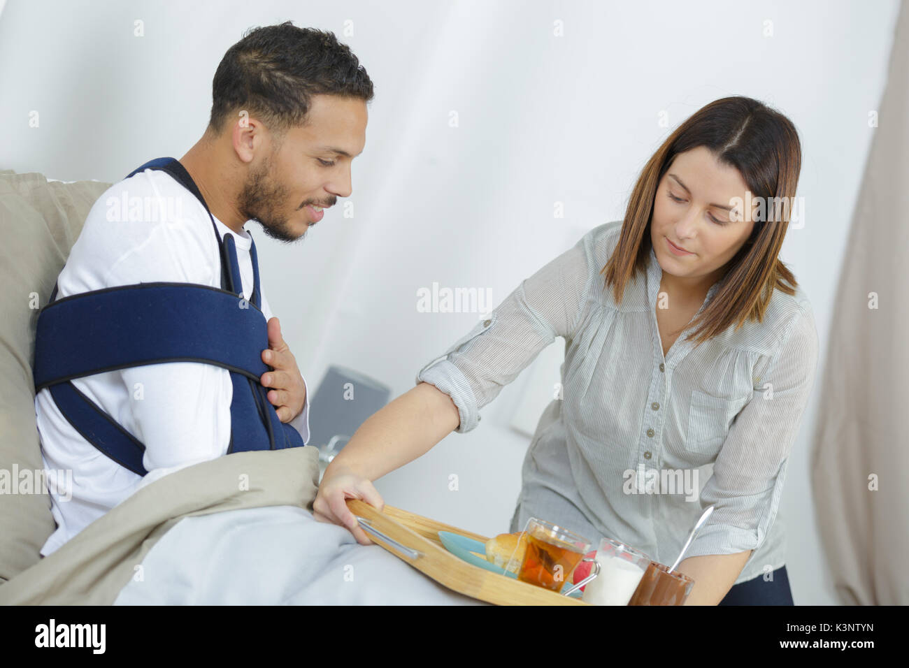 beautiful loving wife caring about her ill husband Stock Photo - Alamy