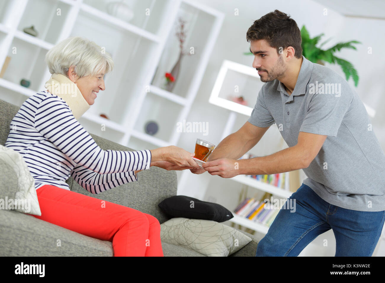 Woman giving tea older woman hi-res stock photography and images - Alamy