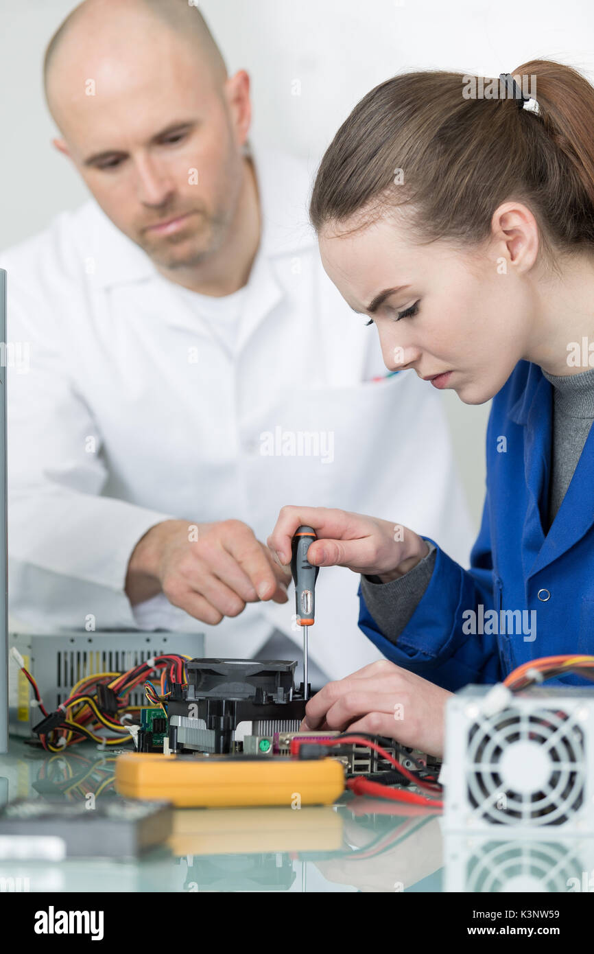 female apprentice learning to use a multimeter Stock Photo - Alamy