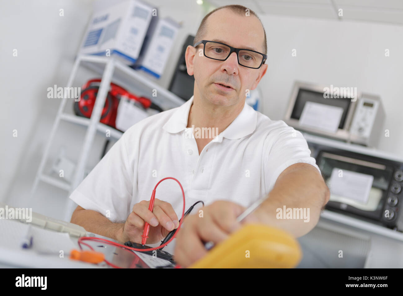 man using an electronic measuring instrument Stock Photo - Alamy