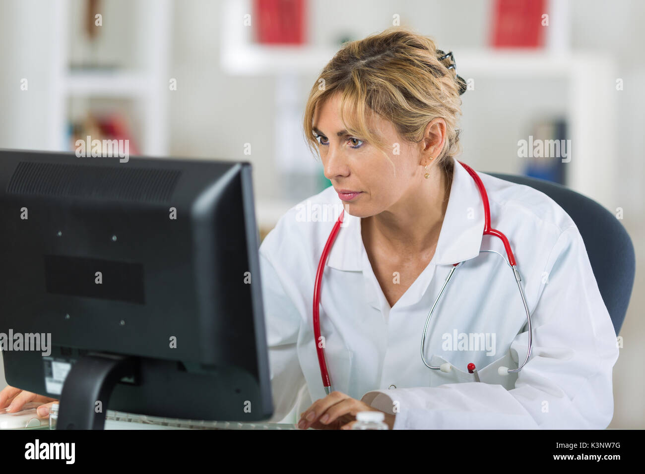 doctor is checking results on her computer Stock Photo - Alamy