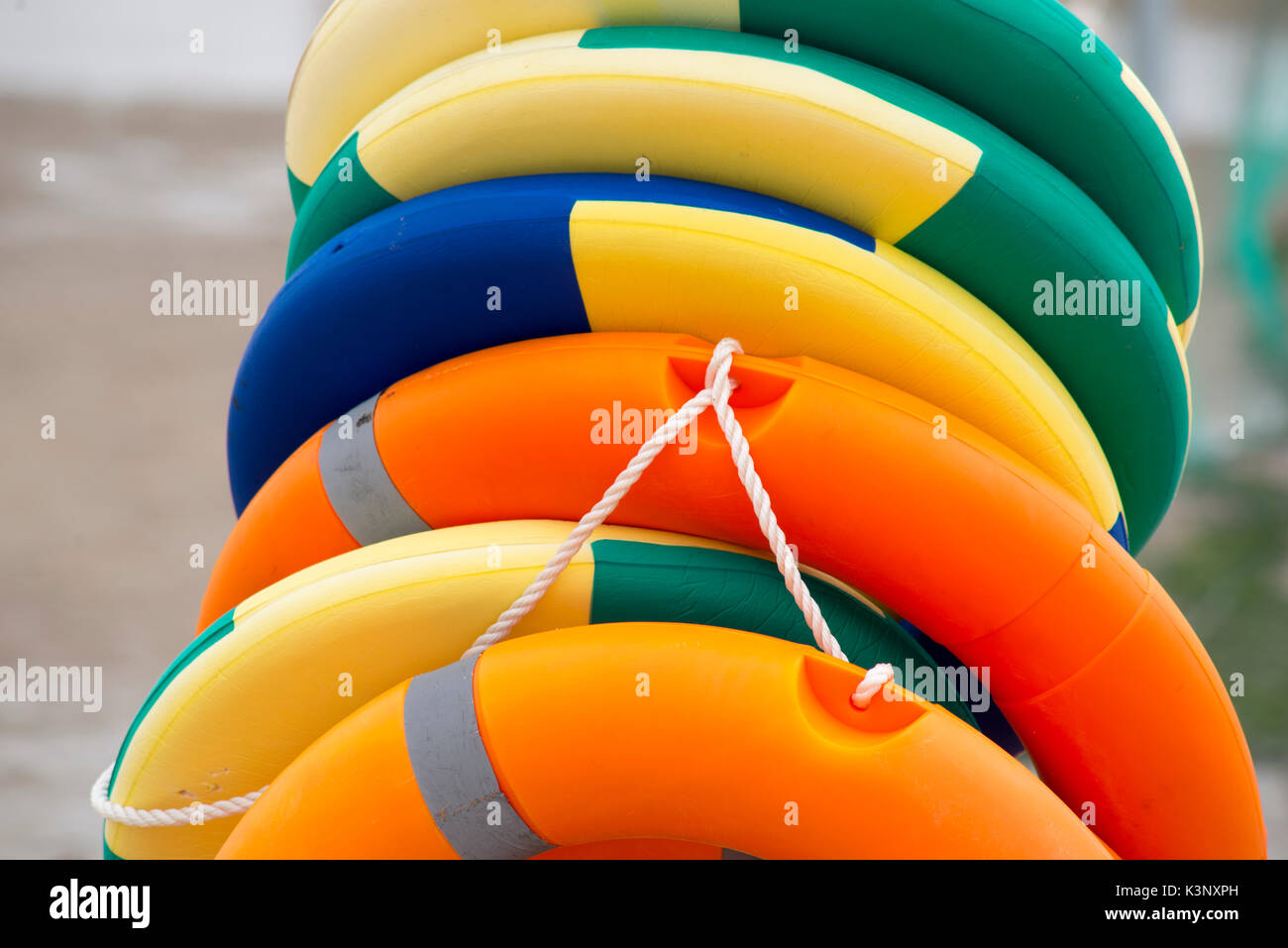 All sorts of color Life rings stacked in a neat from running Stock ...