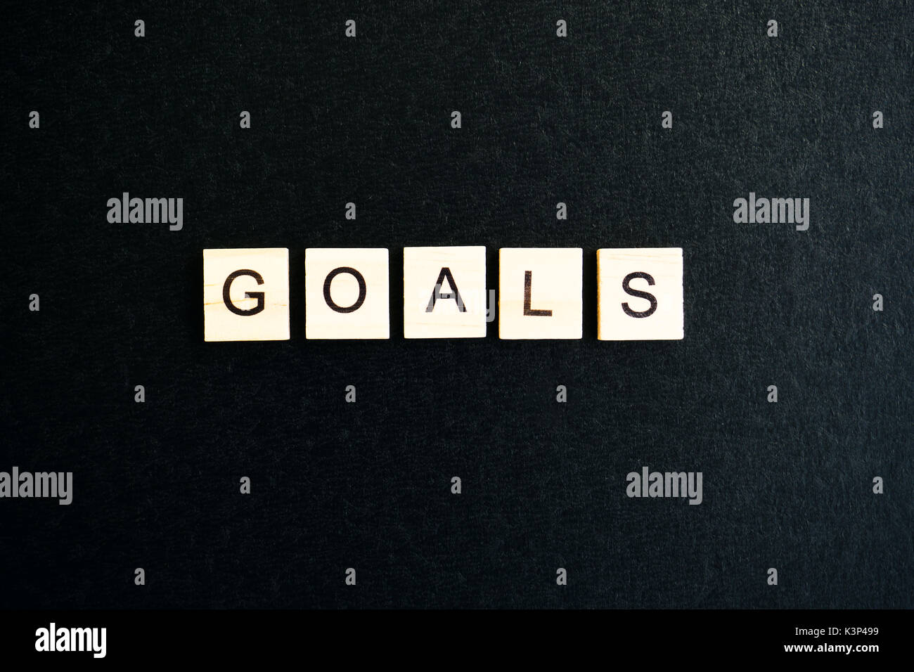 Goals words on wood blocks with black background with filter and analog ...