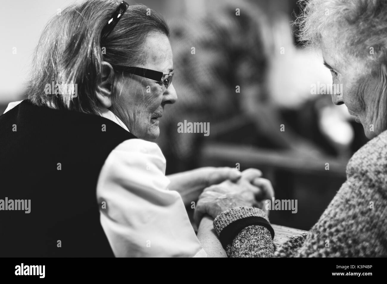 Two old lady prayer in church Stock Photo - Alamy