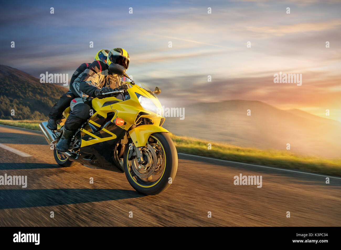 Motorbikers on sports motorbike riding in alpine landscape. Outdoor ...