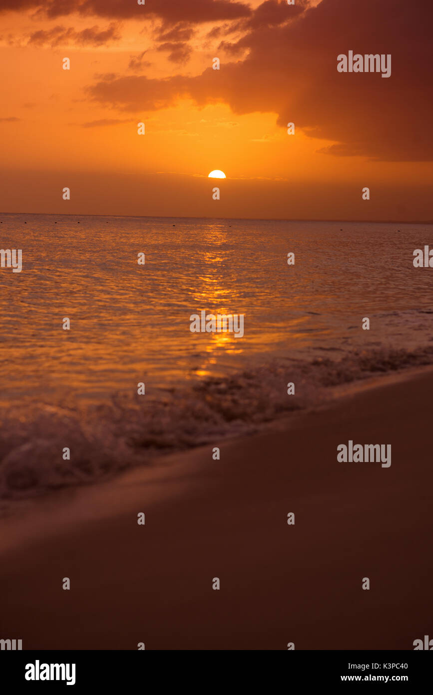 Sunset on the coast of the Caribbean Sea. Dominican sunset Stock Photo ...