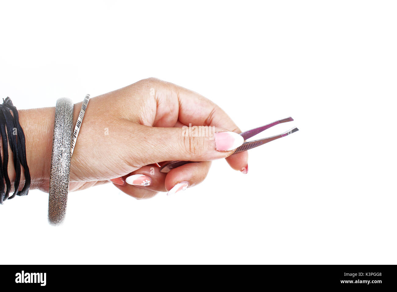 Woman hand holding tweezers on isolated white cutout background. Studio ...
