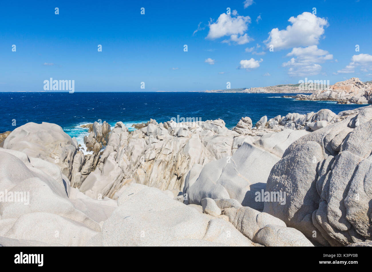 Granitic rocks of cliffs frame the turquoise sea Capo Testa Santa ...