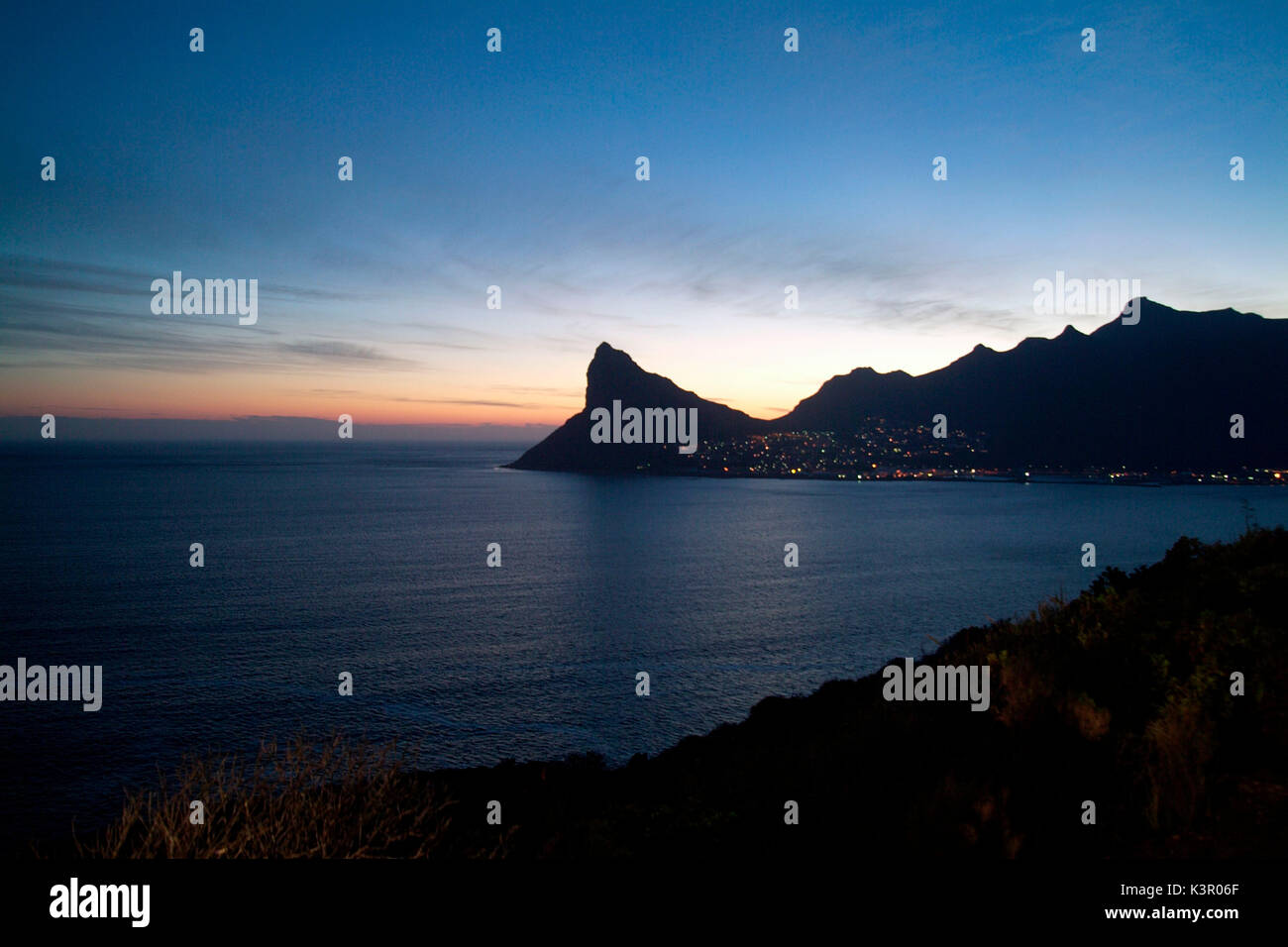 A silhouette of the Sentinel facing Hout Bay in the Cape Peninsula ...