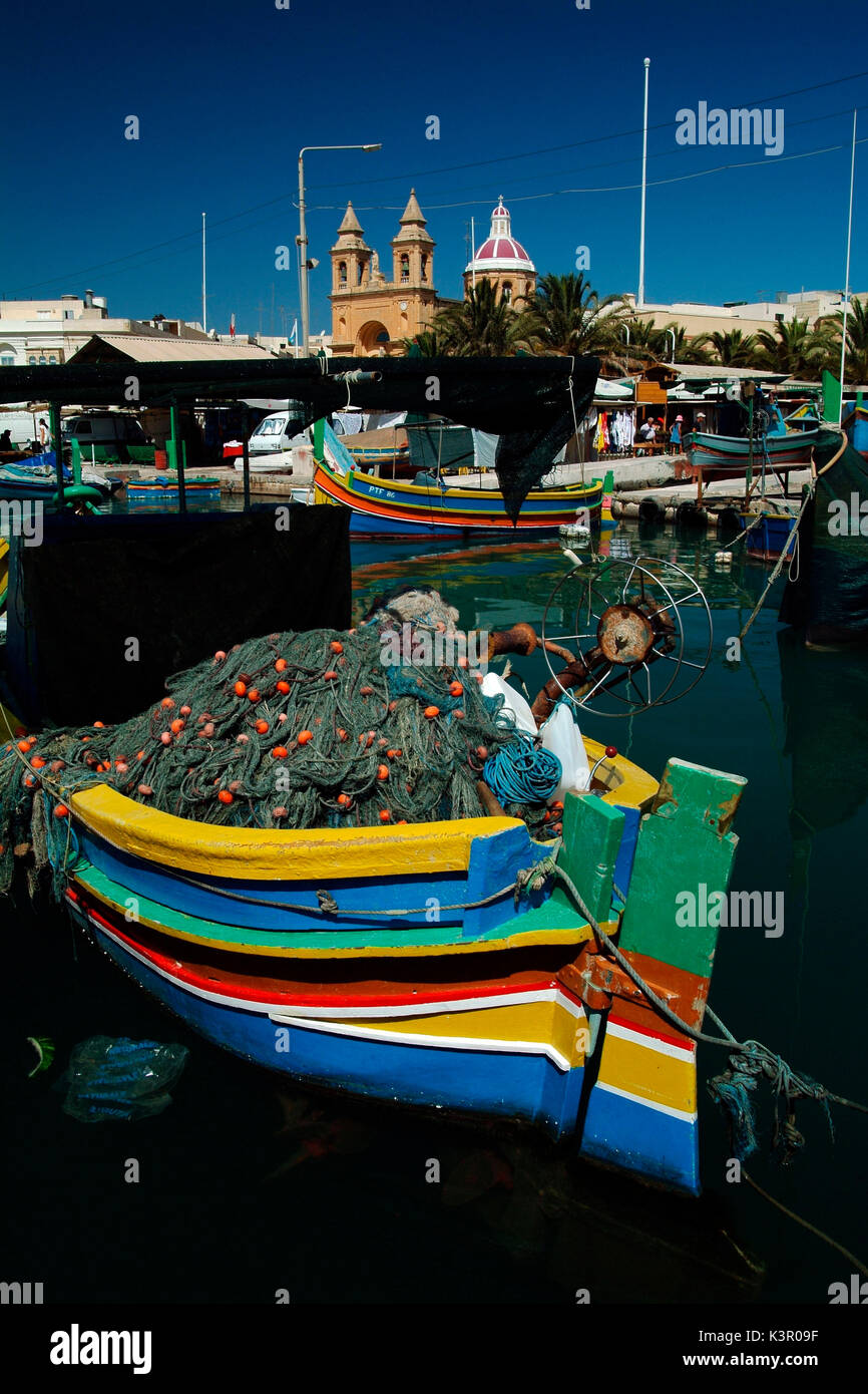 A luzzu, a traditional fishing boat from the Maltese islands. They are ...