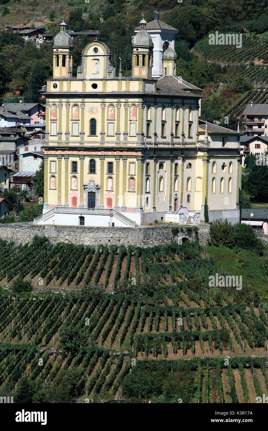 The Santa Casa in Tresivio surrounded by vineyards, Valtellina ...