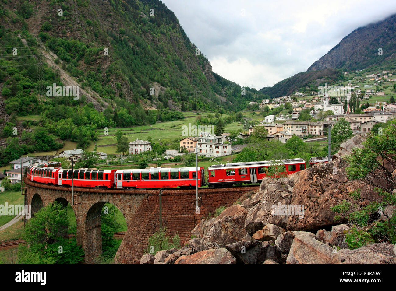 The Bernina Express passing on the viaduct in Brusio, Val Poschiavo ...