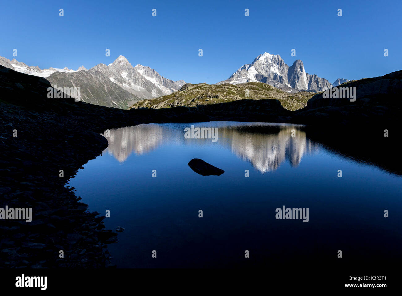 The Mont Blanc mountain range reflected in the waters of Lac de Chesery ...