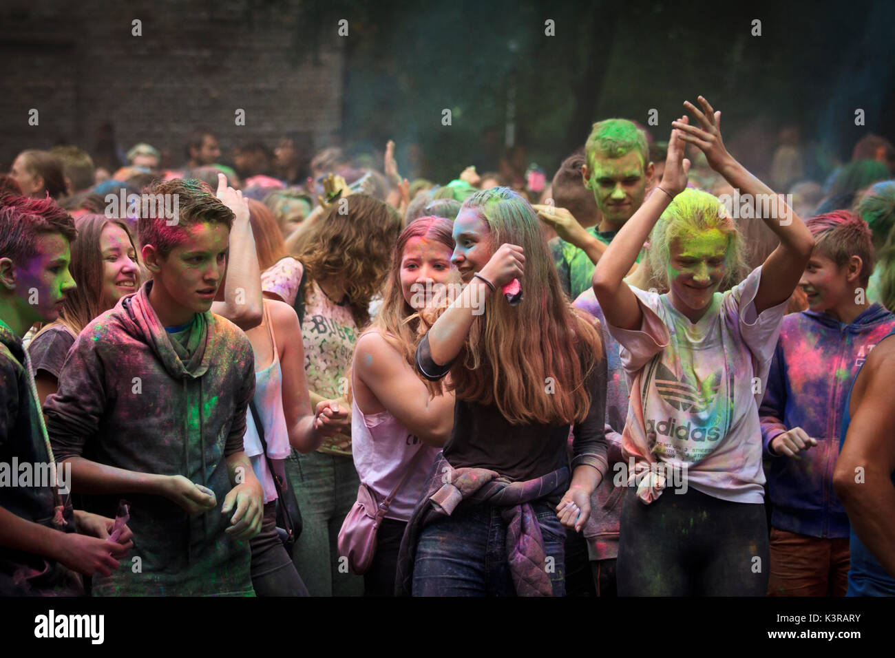 Young, happy people dancing during the holi festival of colours ...