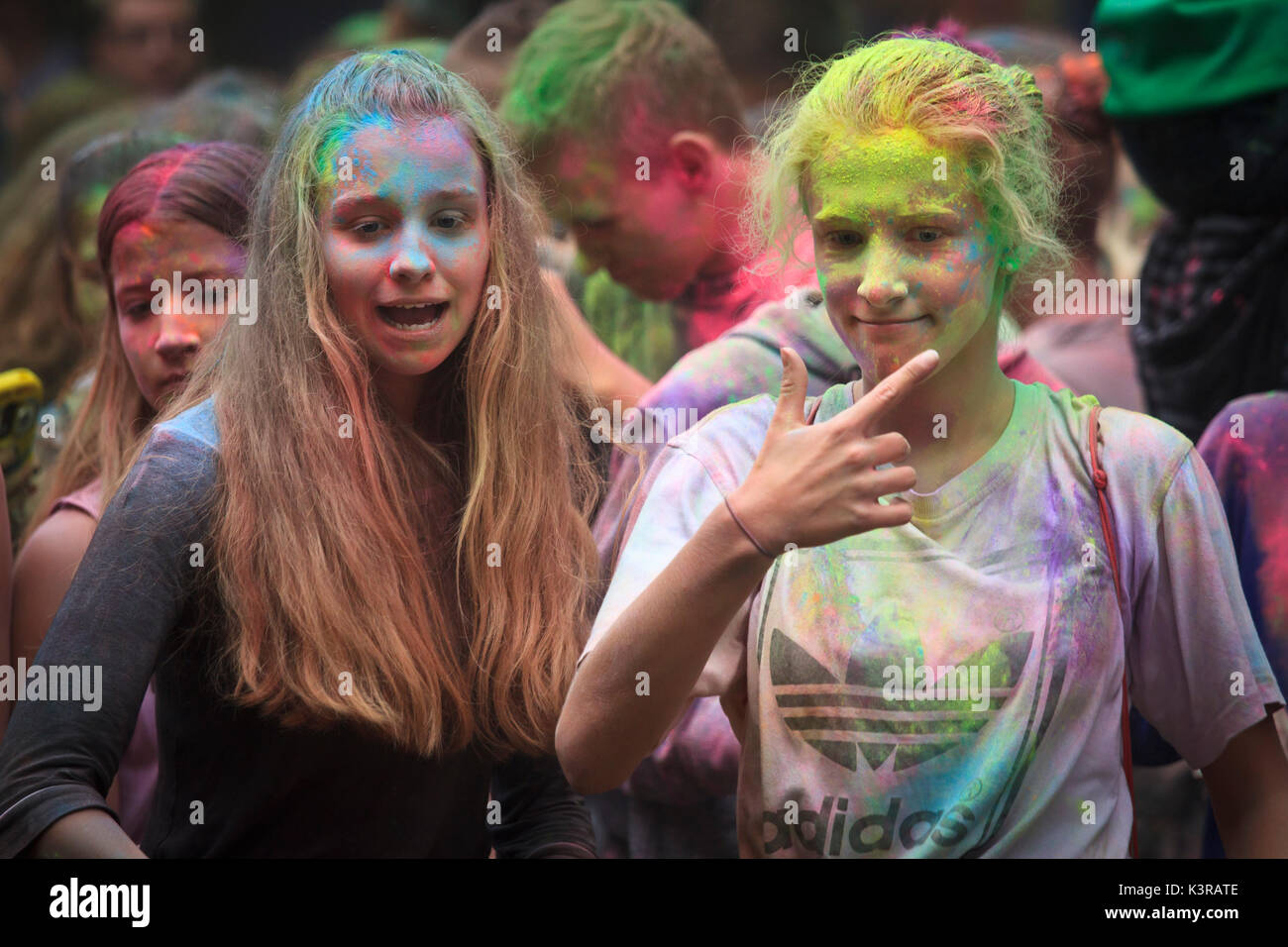 Young, happy people dancing during the holi festival of colours ...