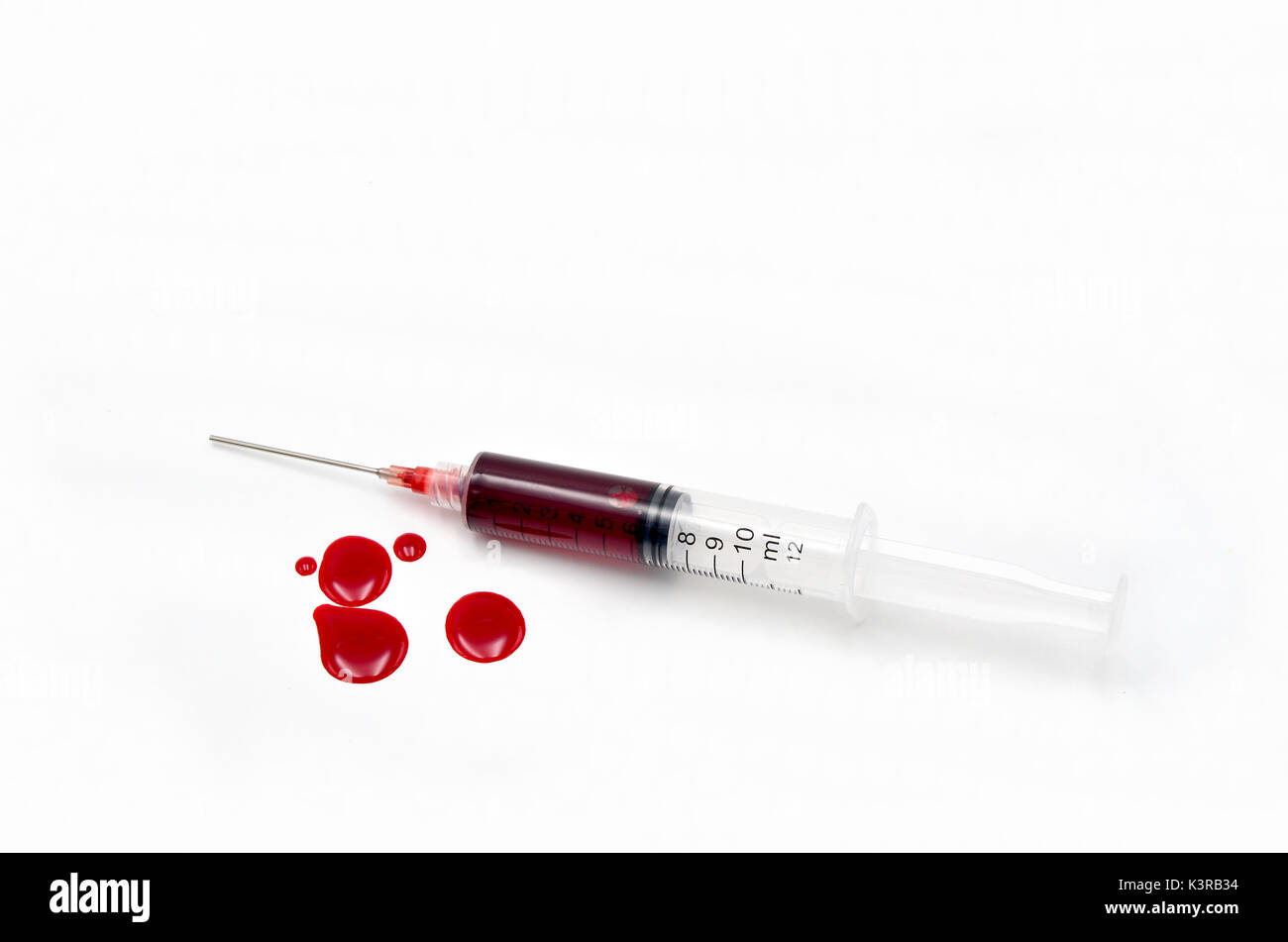 Syringe red drop isolated Cut Out Stock Images & Pictures - Alamy