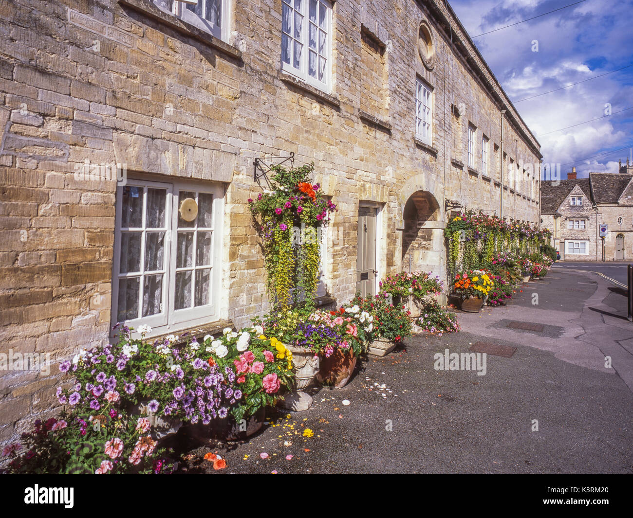 The historic, early 19th century, stone Tontine Buildings, with flower ...