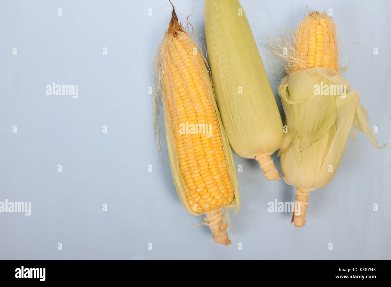 Fresh corn on cobs on texture background, closeup, top view Stock Photo ...