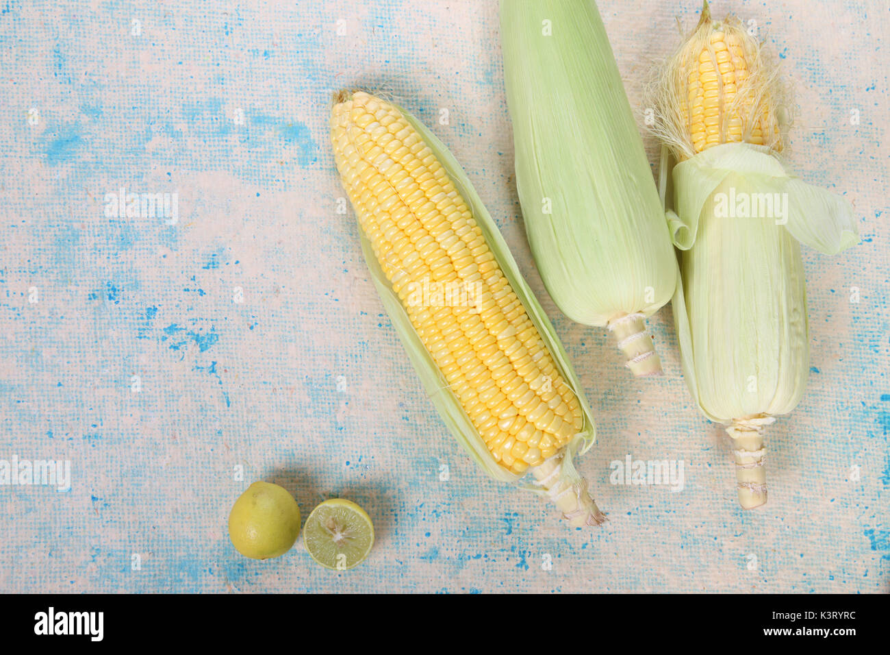 Fresh corn on cobs on texture background, closeup, top view Stock Photo ...