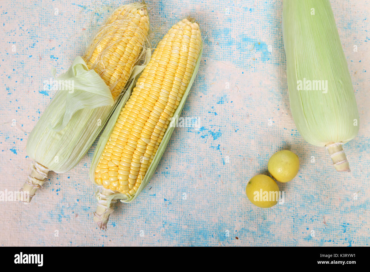Fresh corn on cobs on texture background, closeup, top view Stock Photo ...