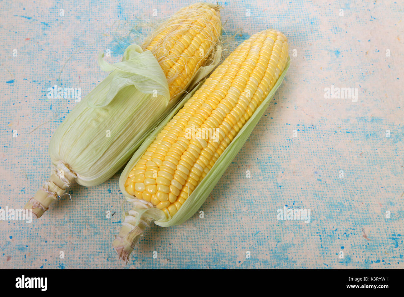 Fresh corn on cobs on texture background, closeup, top view Stock Photo ...