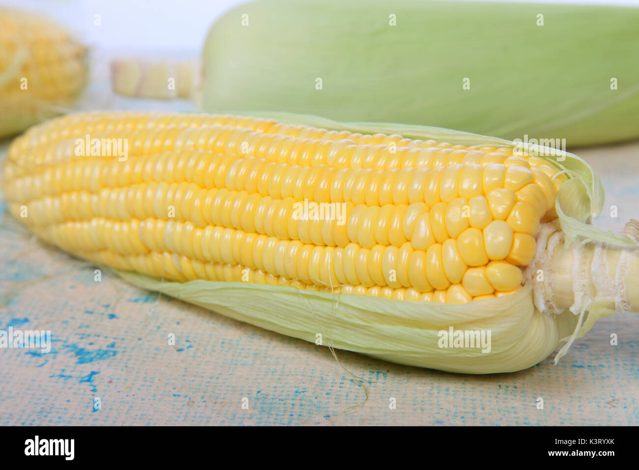 Fresh corn on cobs on texture background, closeup, top view Stock Photo ...