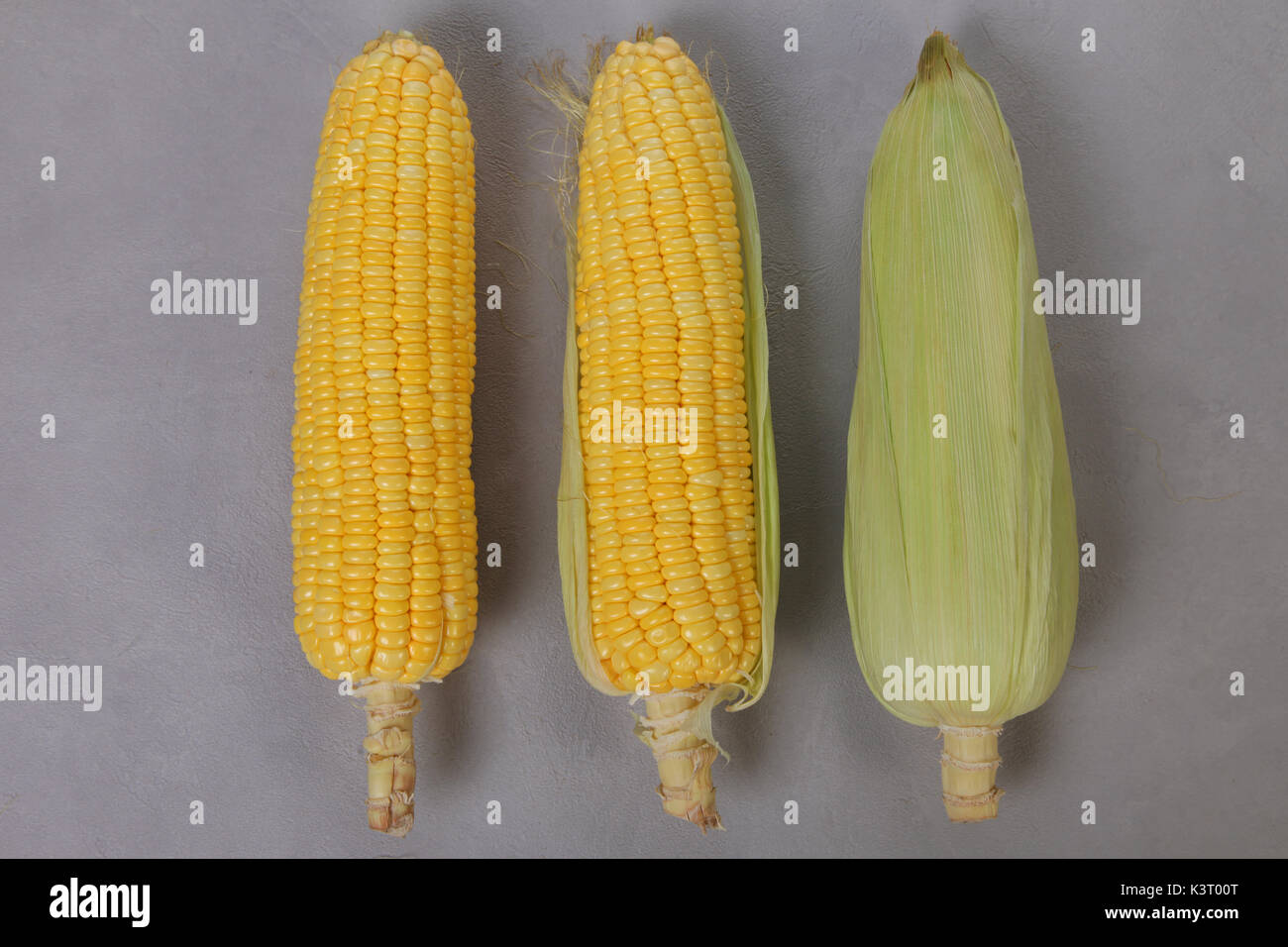 Fresh corn on cobs on texture background, closeup, top view Stock Photo ...