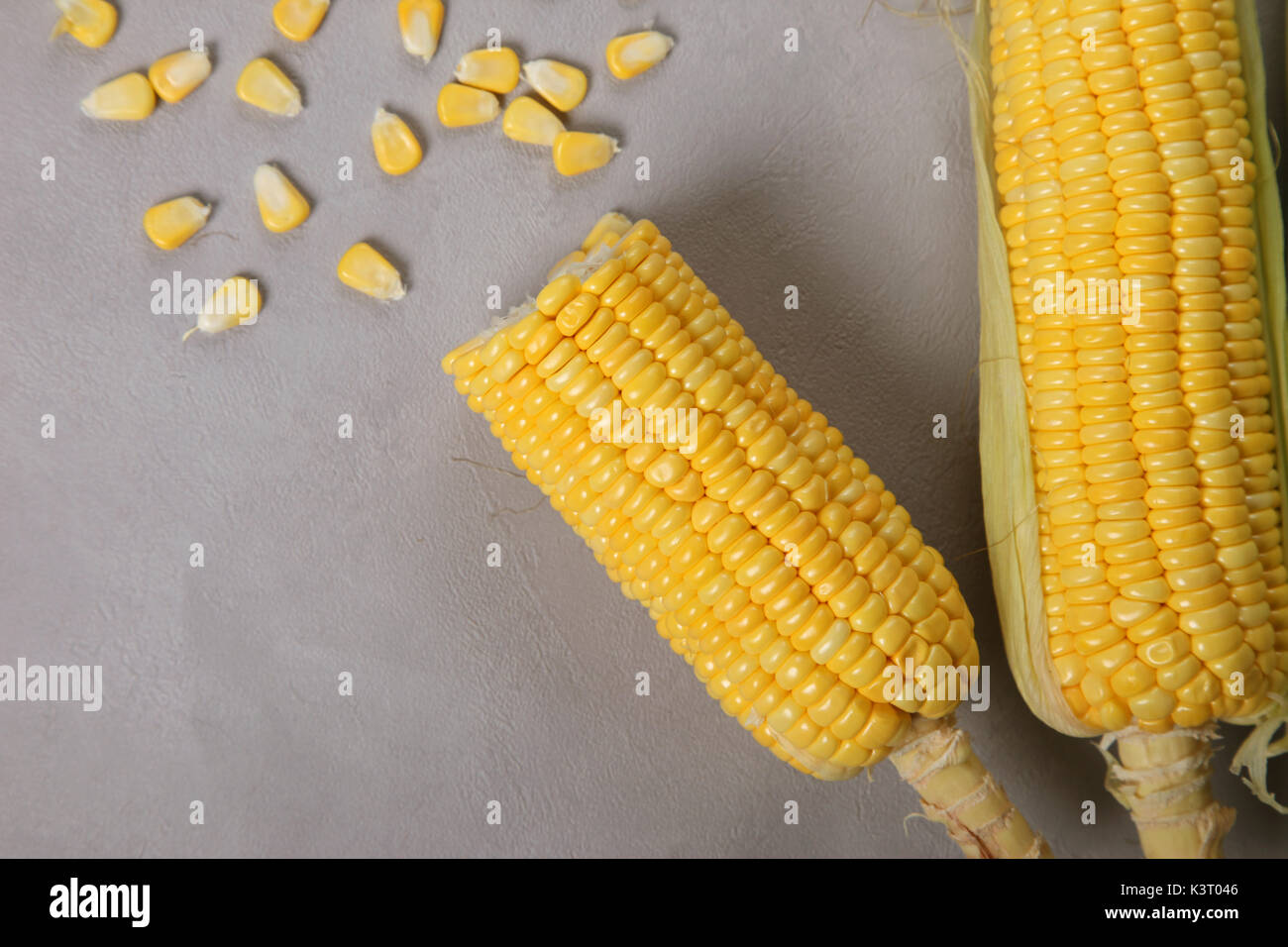 Fresh corn on cobs on texture background, closeup, top view Stock Photo ...