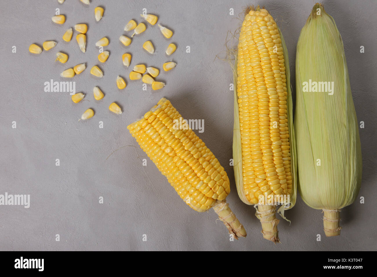 Fresh corn on cobs on texture background, closeup, top view Stock Photo ...