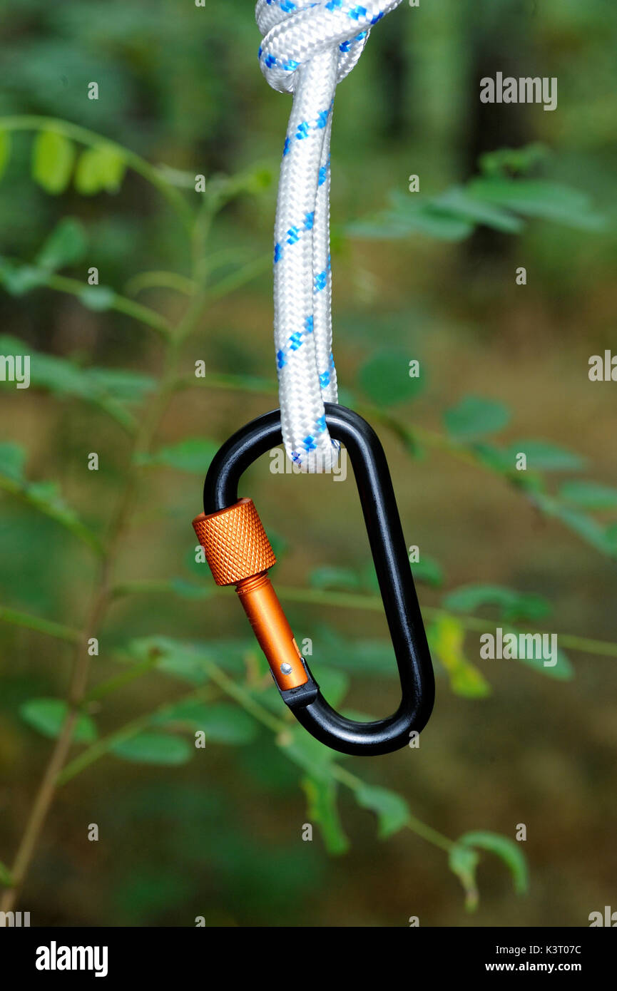 Carabiner with rope on nature background. Climbing uquipment.Climbing ...