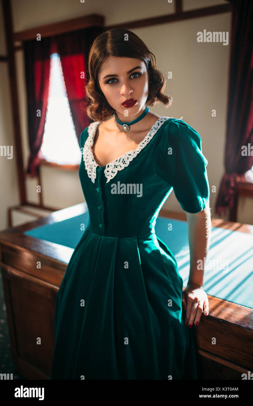 Beautiful woman in retro train, rich wagon interior. Railroad voyage ...