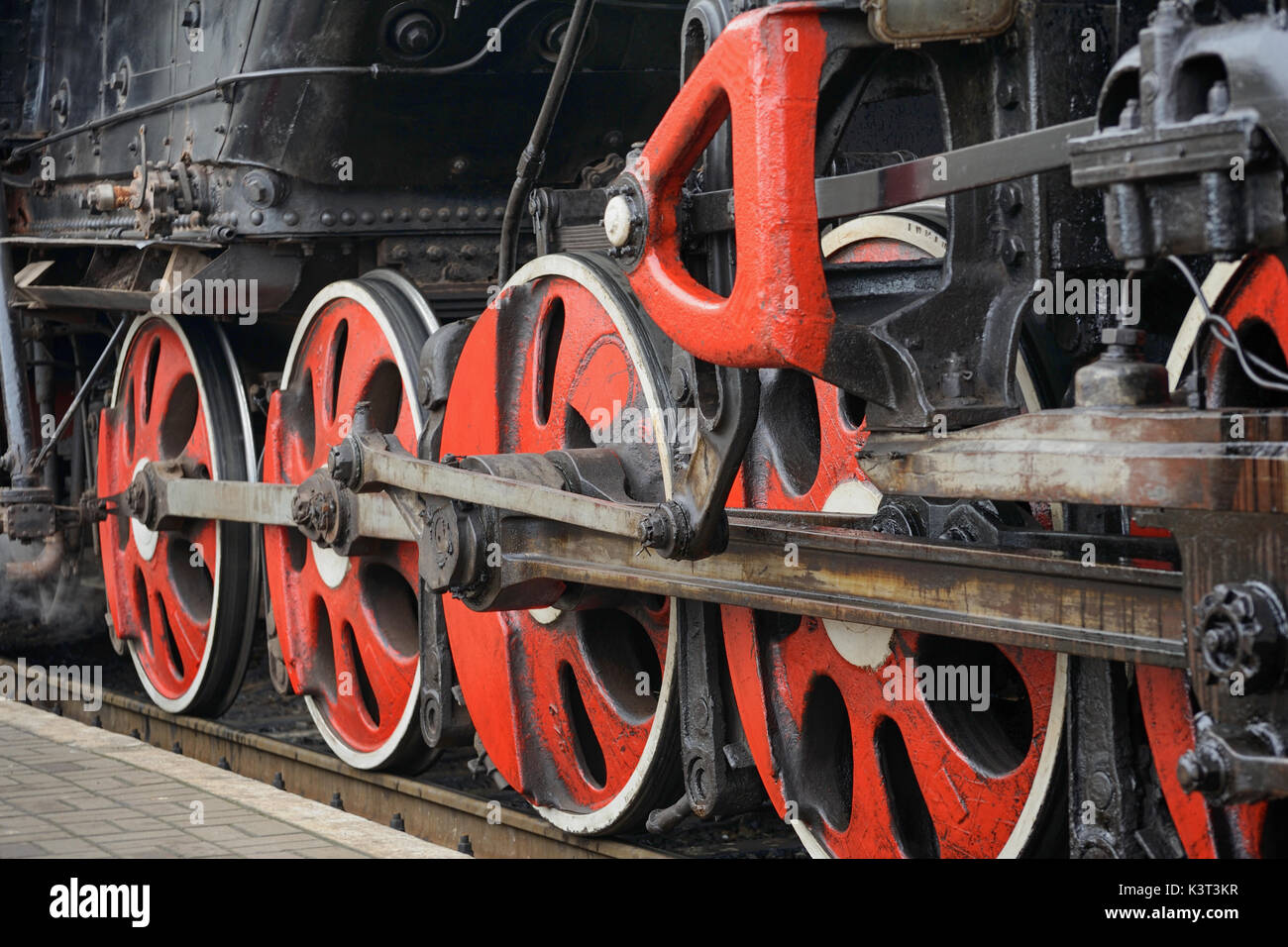 Train drive mechanism and red wheels of an old soviet steam locomotive ...