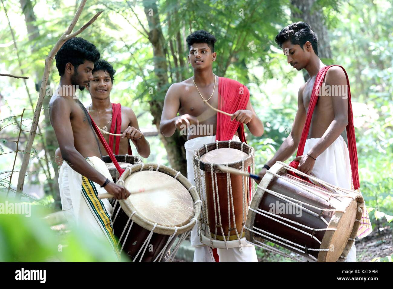 KERALA, INDIA - SEPTEMBER 3: Percussion (chenda) artists add to the ...