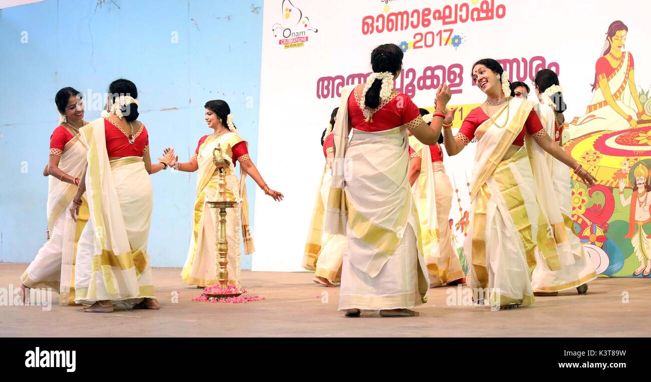 KERALA, INDIA - SEPTEMBER 3: Women in their traditional attire dance to ...