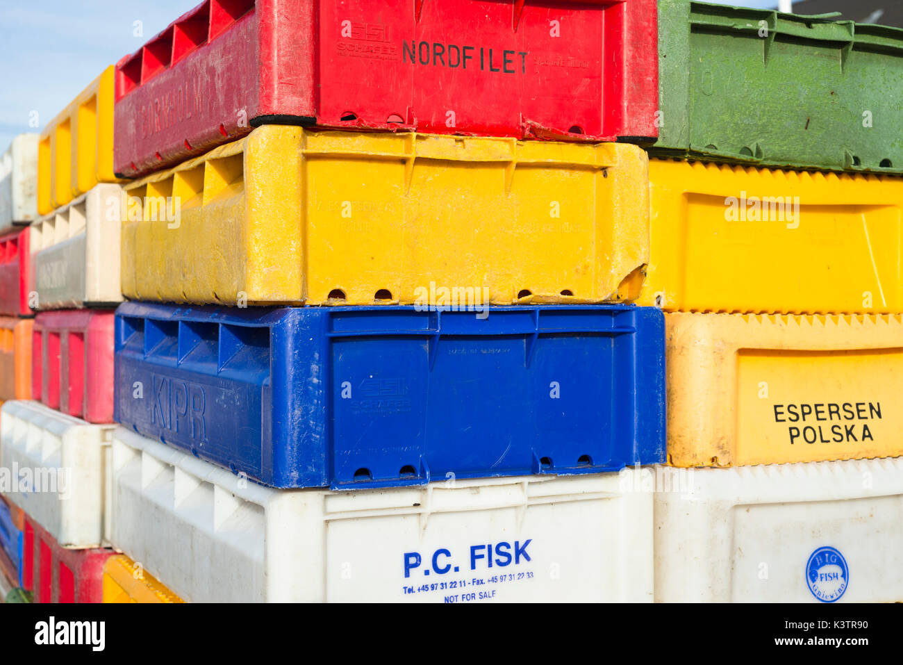 Colorful stack of boxes for storing fish in the port of Vitte ...