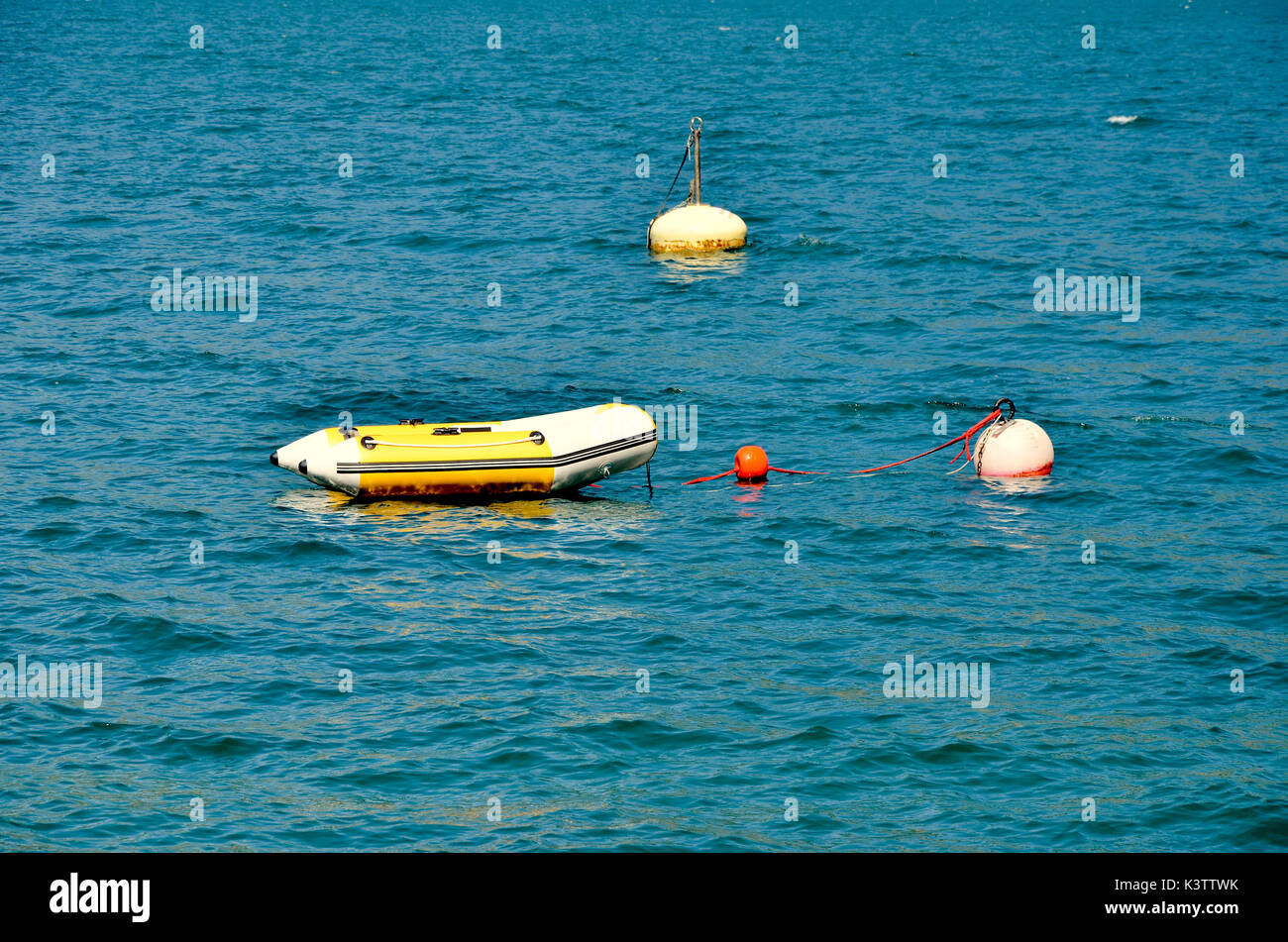 rubber boat with boay in water Stock Photo - Alamy
