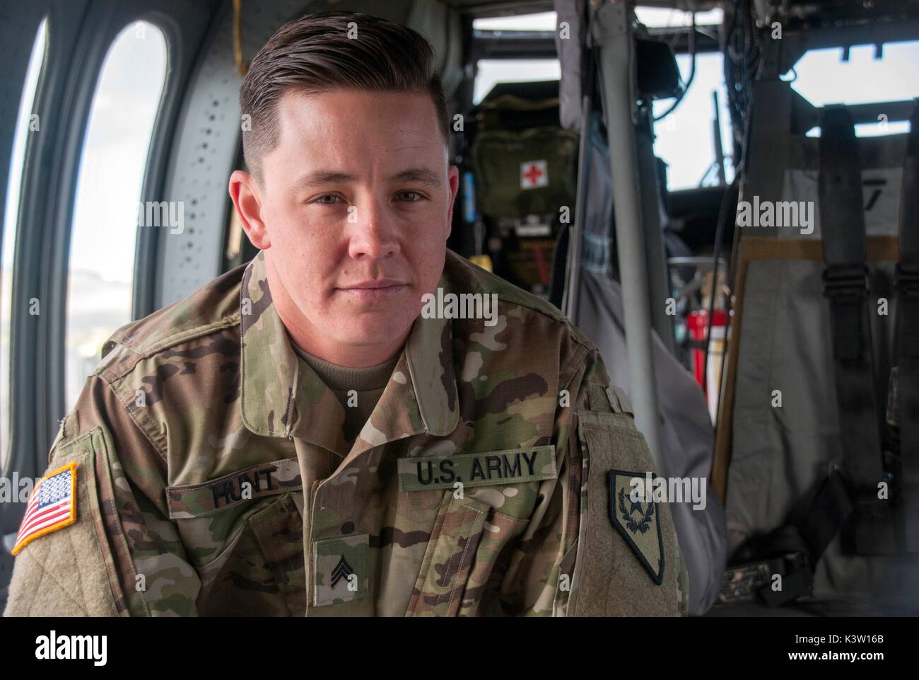 U.S. Army National Guard soldier Sam Hunt poses inside of an aircraft ...