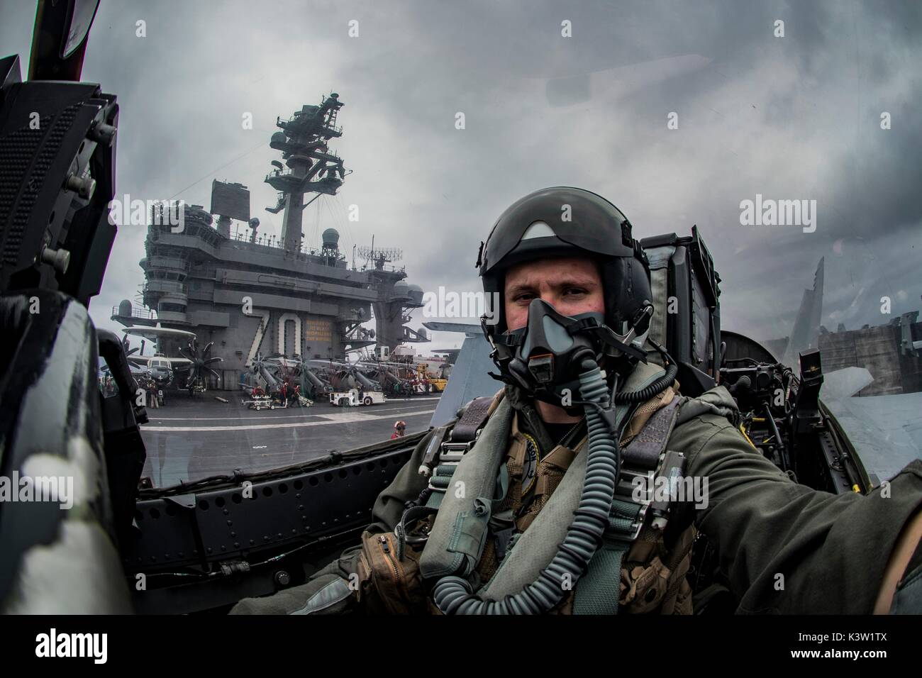 A U.S. Navy F/A-18F Super Hornet jet fighter aircraft pilot lands on ...