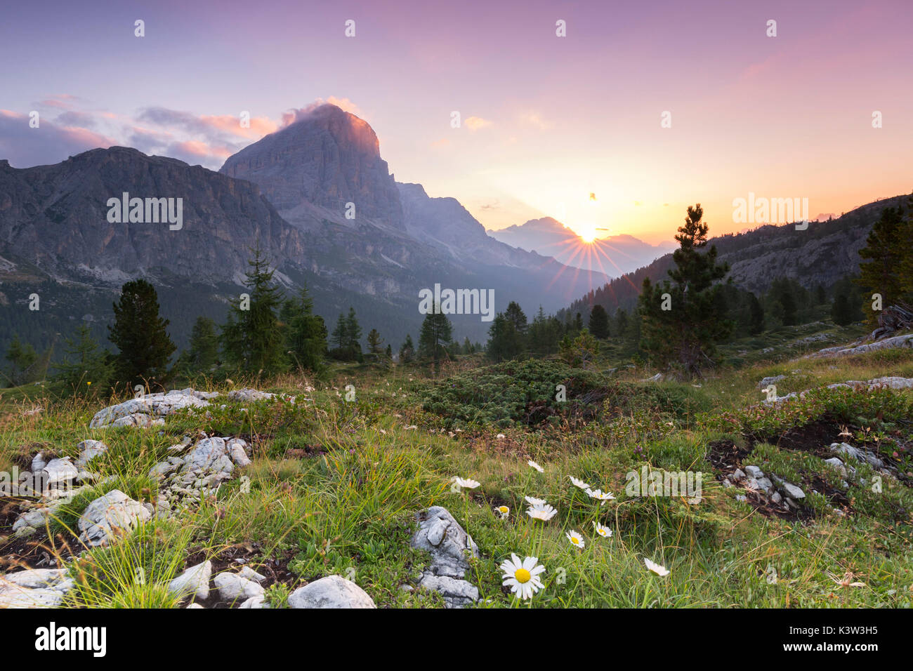 The sun rises behind Mount Cristallo,Cortina d'Ampezzo,Belluno district ...