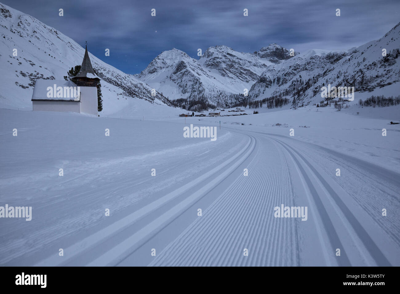View of the Walser church of Sertig Dorfli during a full moon night ...