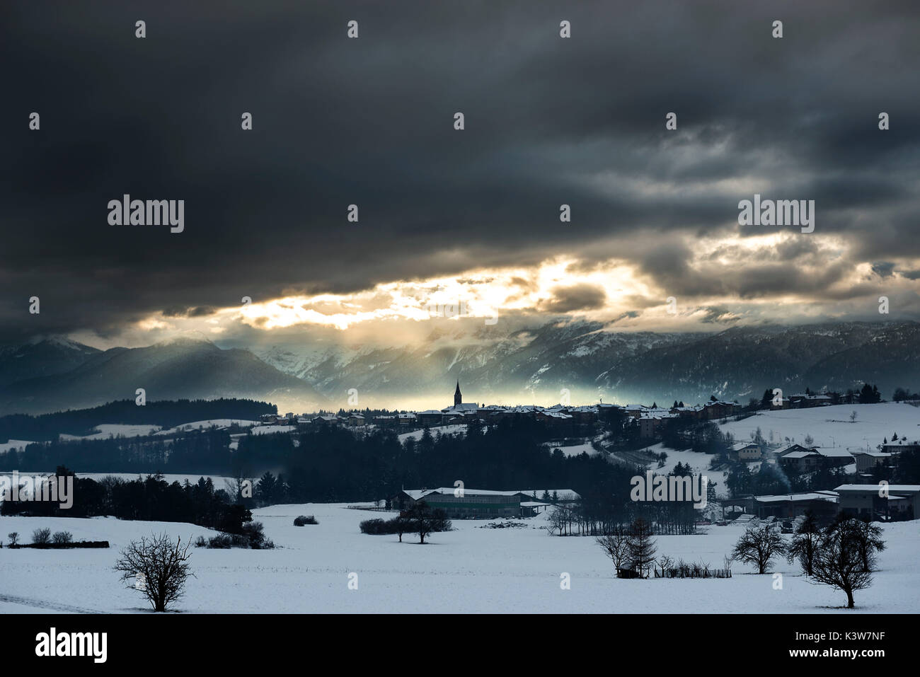 Italy, Trentino Alto Adige, Non valley, play light over Romeno village ...