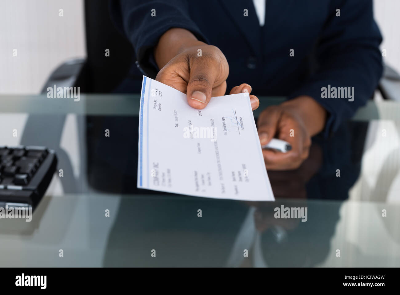 Close-up Photo Of Person's Hand Giving Cheque Stock Photo - Alamy