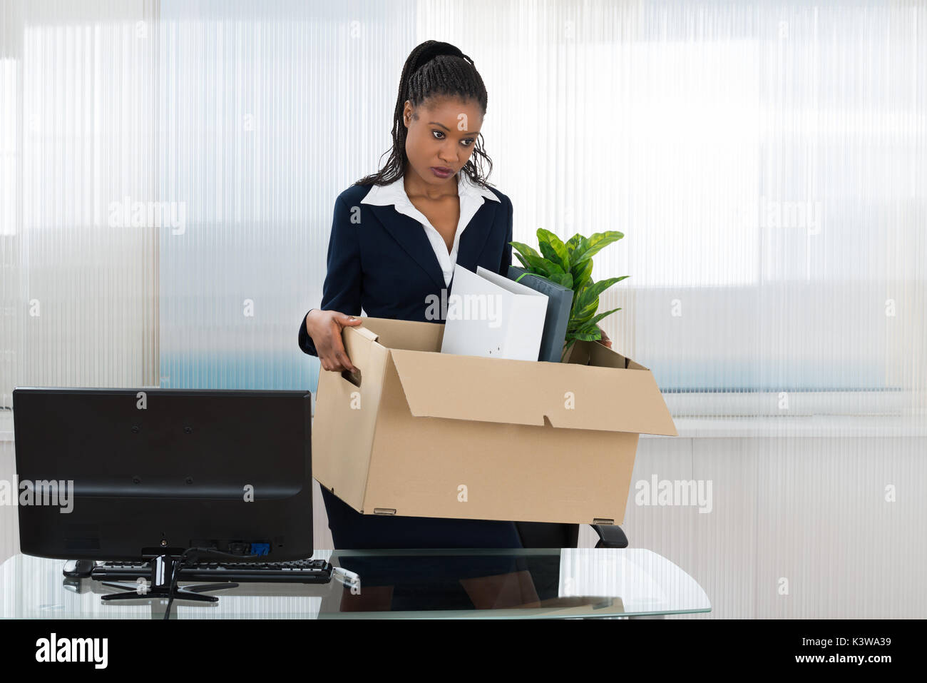One woman office carrying box hi-res stock photography and images - Alamy