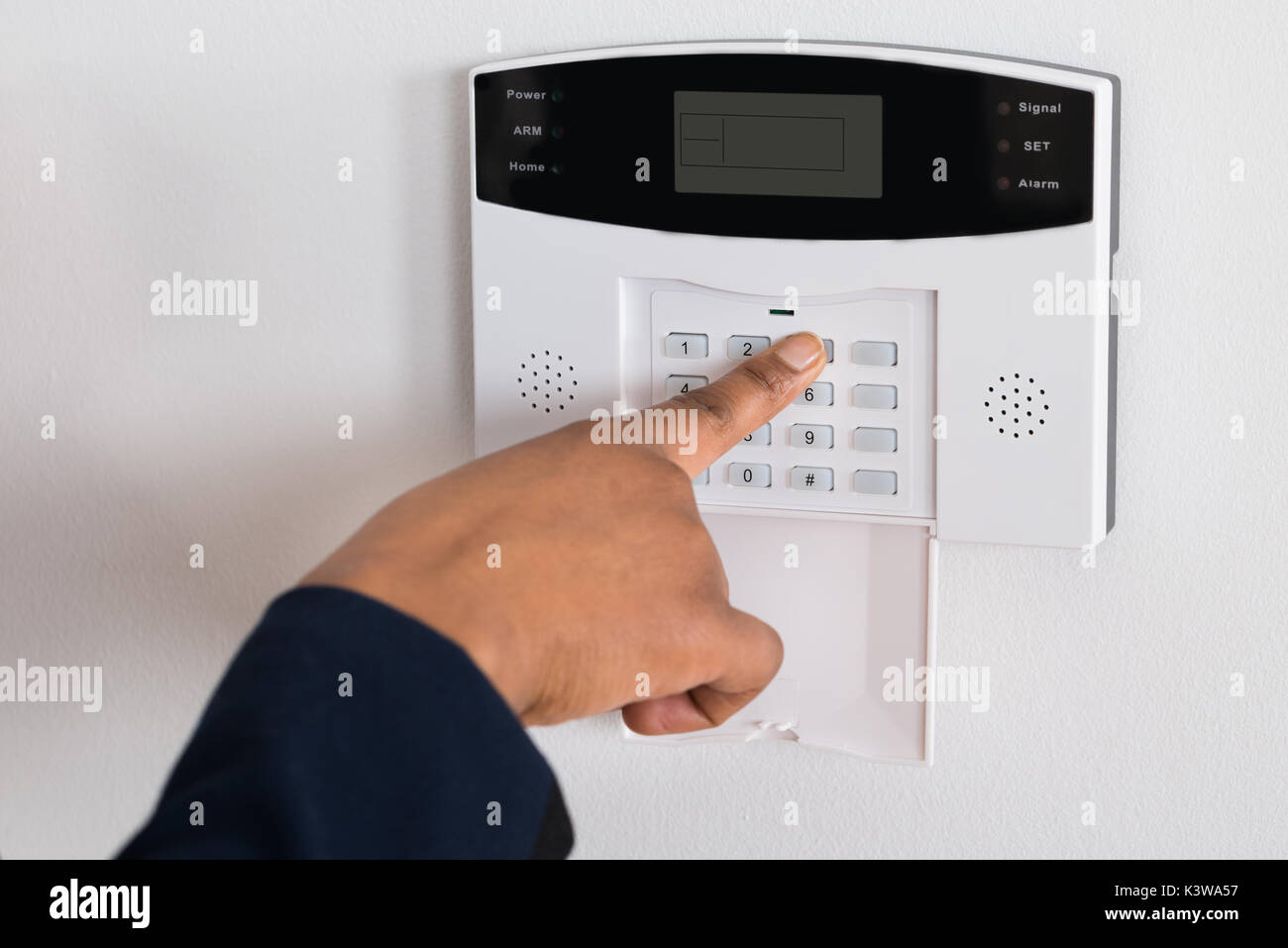 Close-up Of A Person's Hand Entering Code In Security System Stock ...