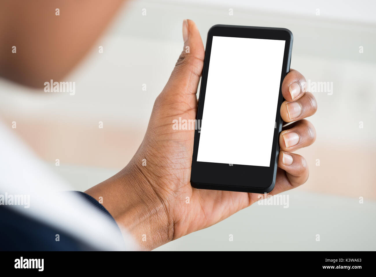 Close-up Of Woman's Hand Holding Mobile Phone With Blank Screen Stock ...