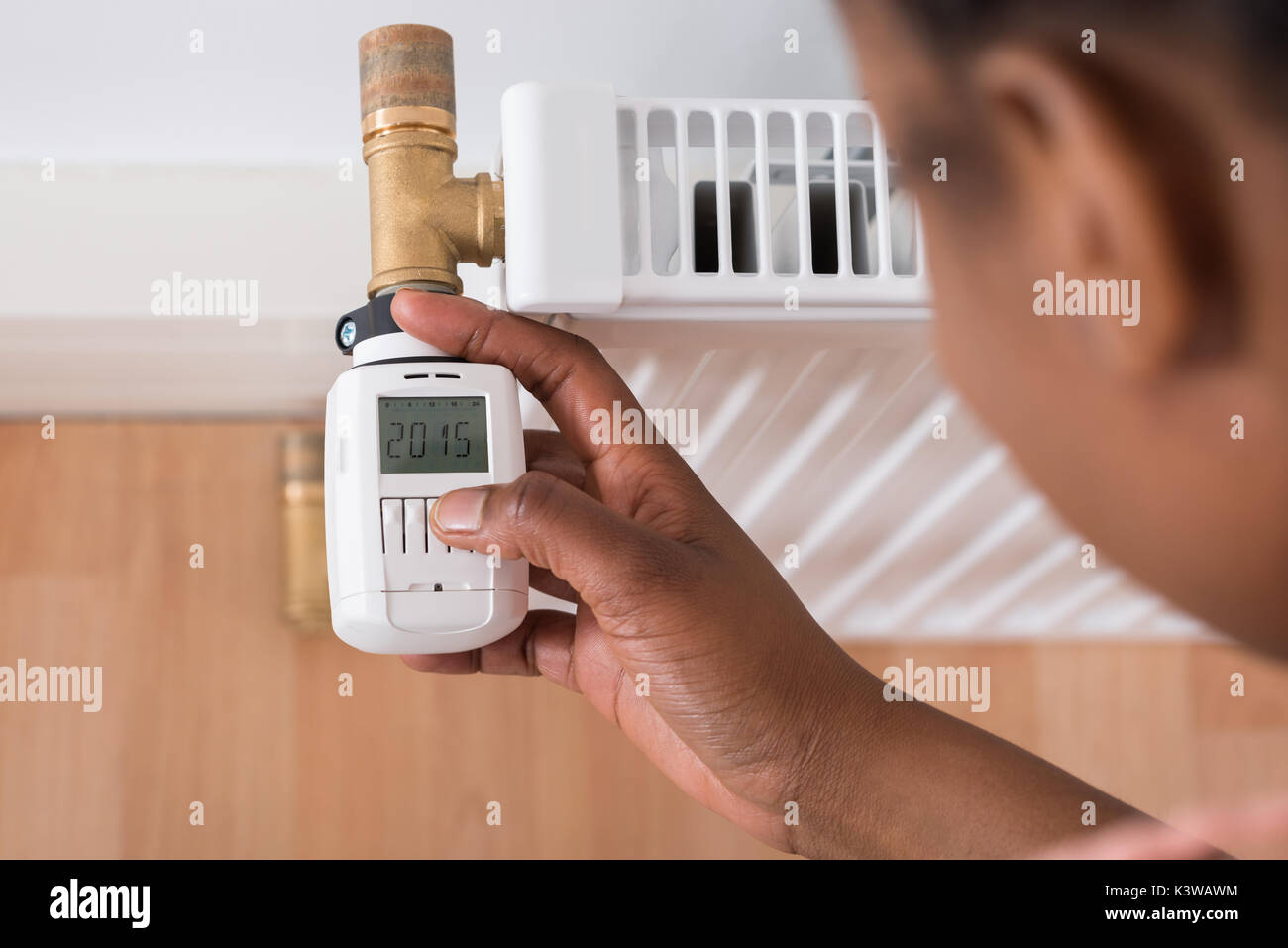 Close-up Of A Woman Adjusting Temperature On Thermostat Stock Photo - Alamy