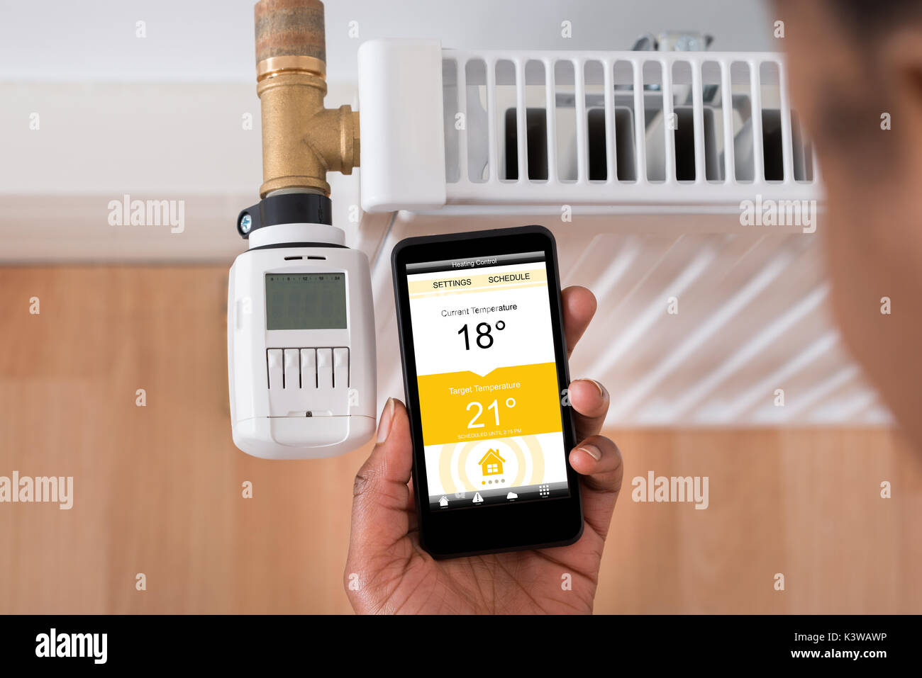 Close-up Of A Person's Hand Adjusting Temperature On Thermostat Using ...